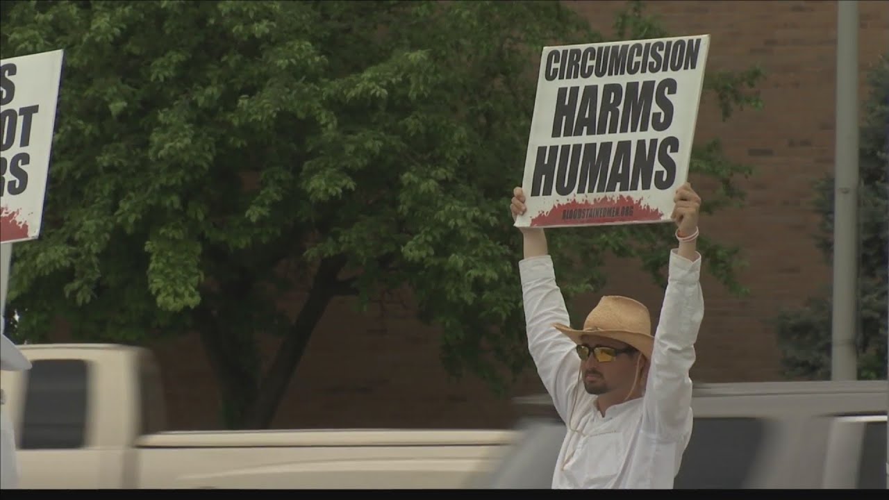 Group catches attention while protesting against circumcision - YouTube