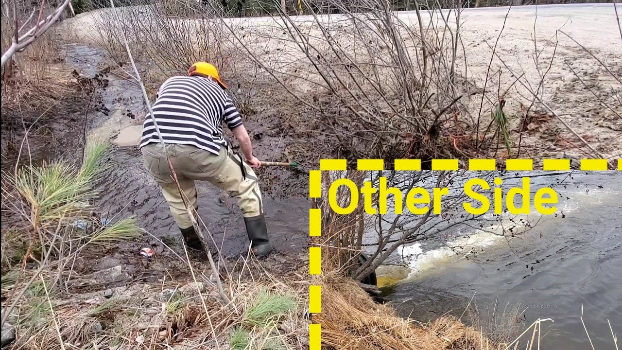 Unclogging Bad Culvert Clogs - YouTube