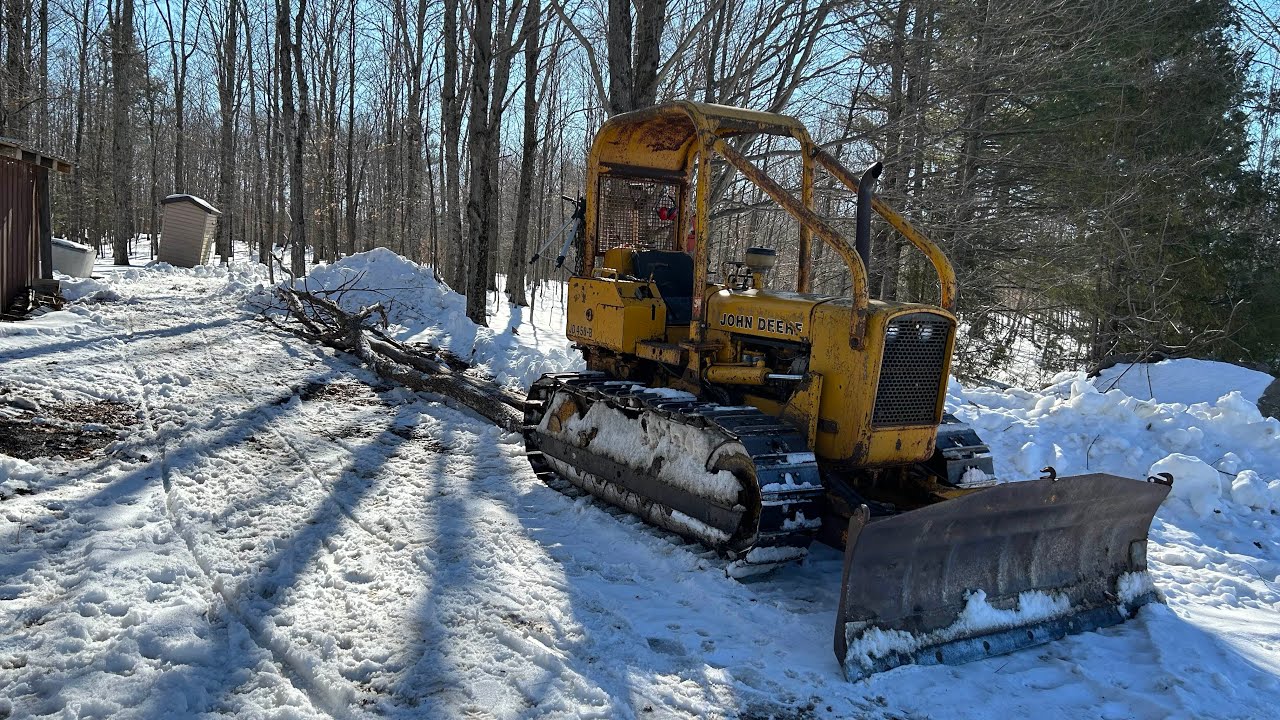Cutting and skidding wood with John Deere 450B bulldozer - YouTube