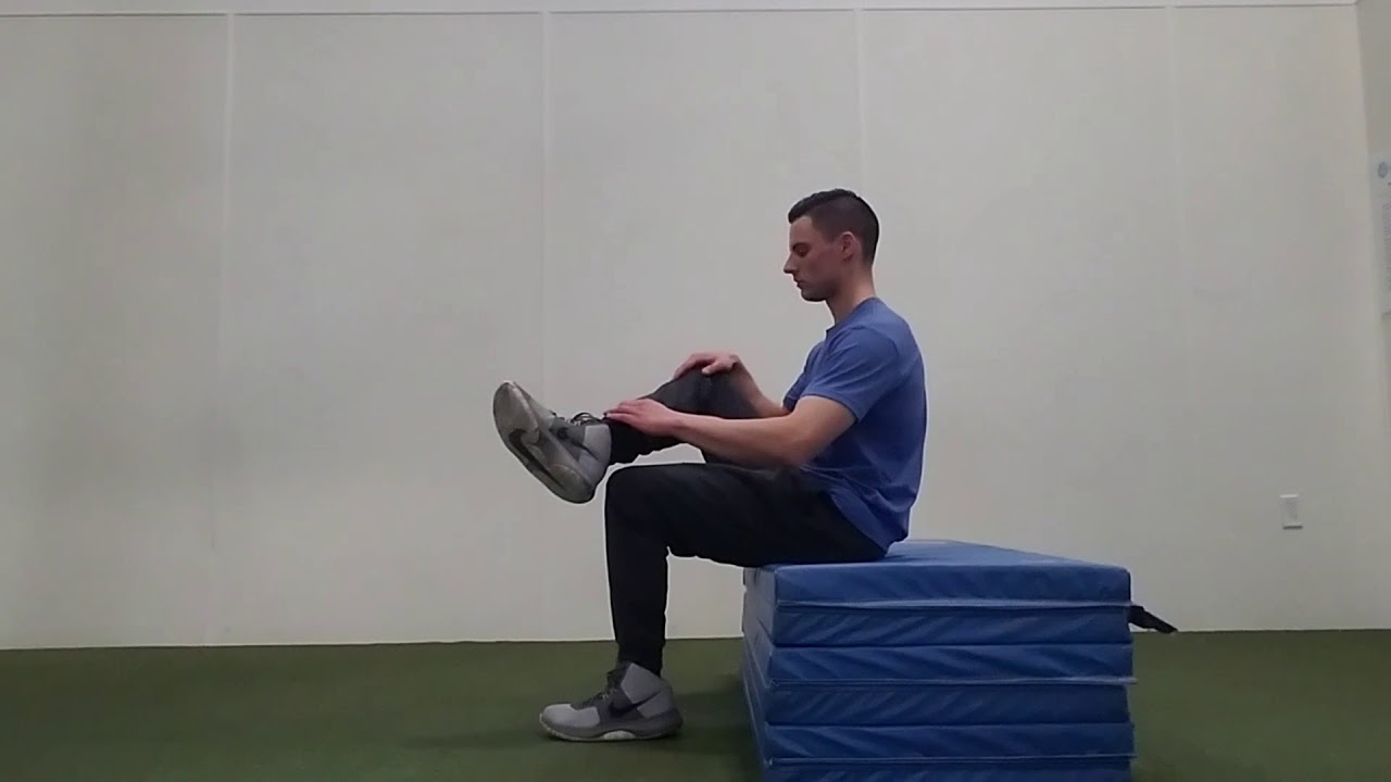Seated Crossover Stretch - YouTube