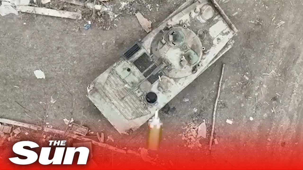 Ukrainian forces blow up Russian tank by dropping bombs into open hatch ...