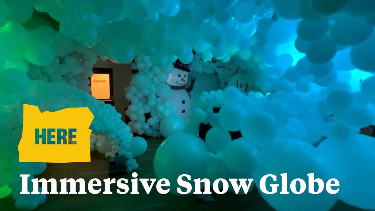 Step inside a life-size snow globe made from hundreds of balloons at ...