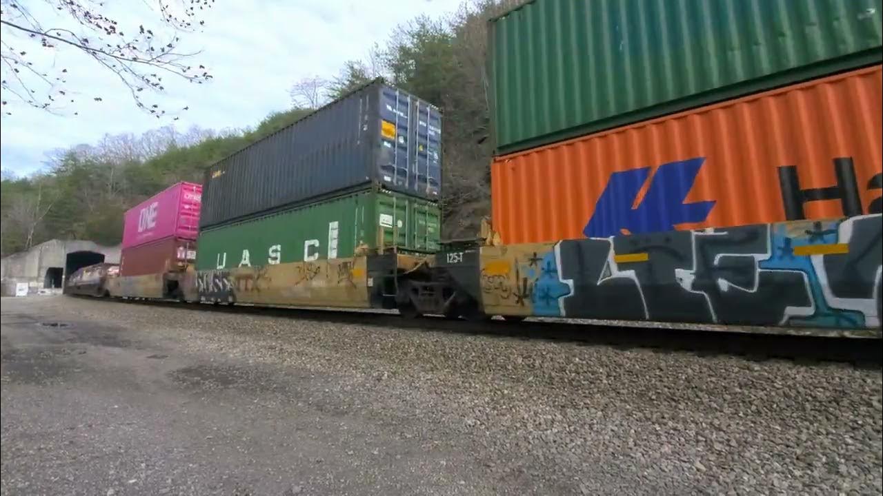 NS 4623 exits Nemo Tunnel with the eastbound stack & rack...NS 4389 as rear pusher - YouTube