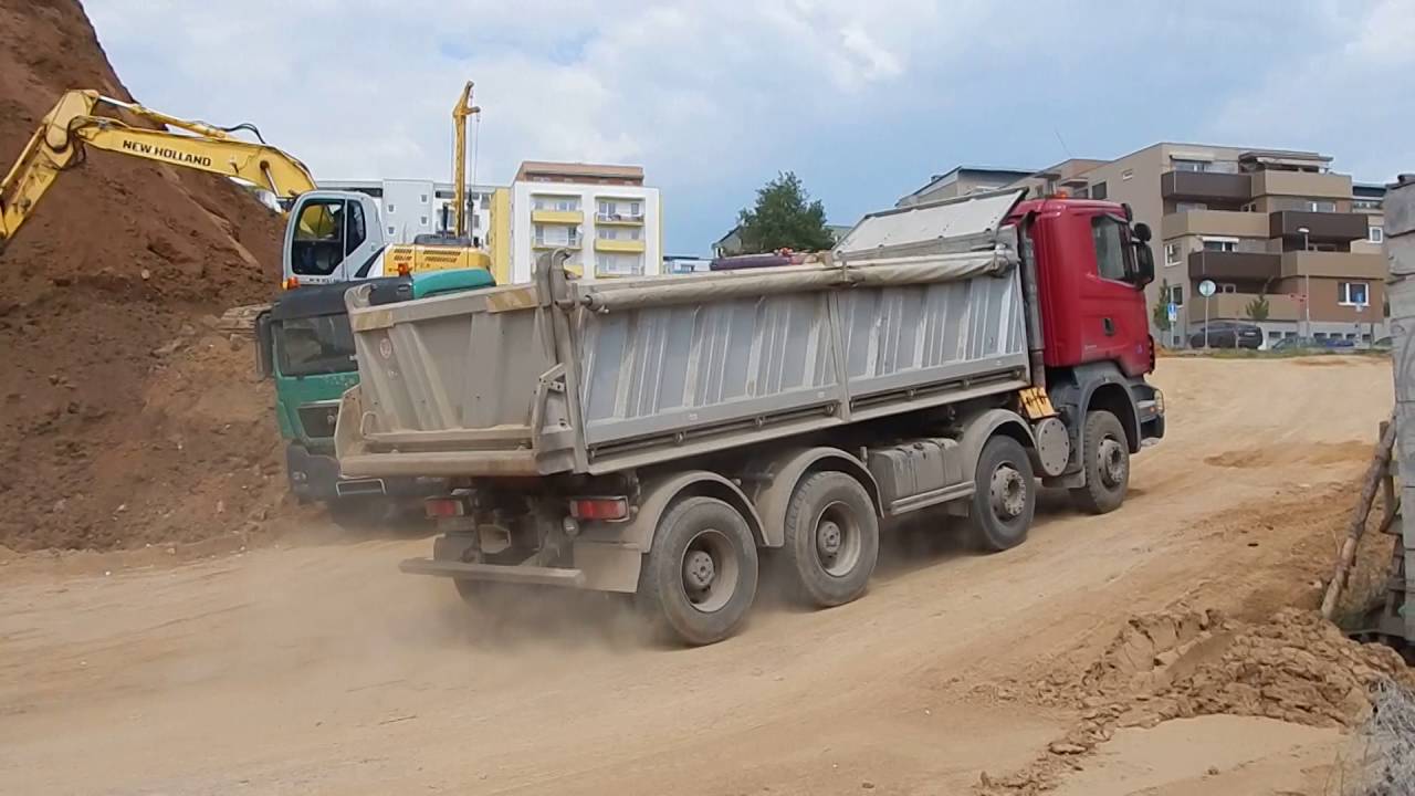 New Holland and MAN trucks and Scania in action - YouTube