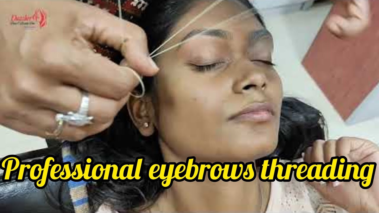 Threading eyebrows and forehead in beauty parlour| professional ...