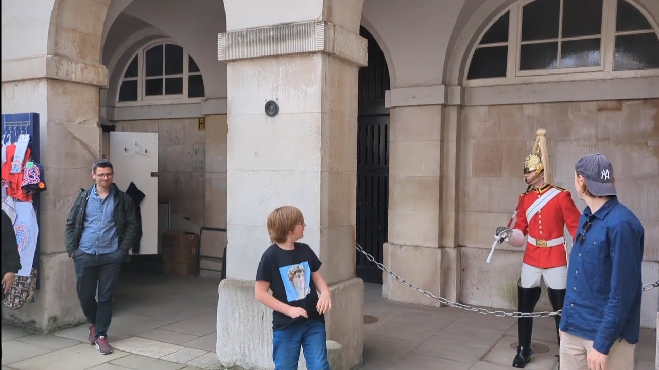 Tourist walks in to the arch Guard stamps his foot and shouts Two boys ...