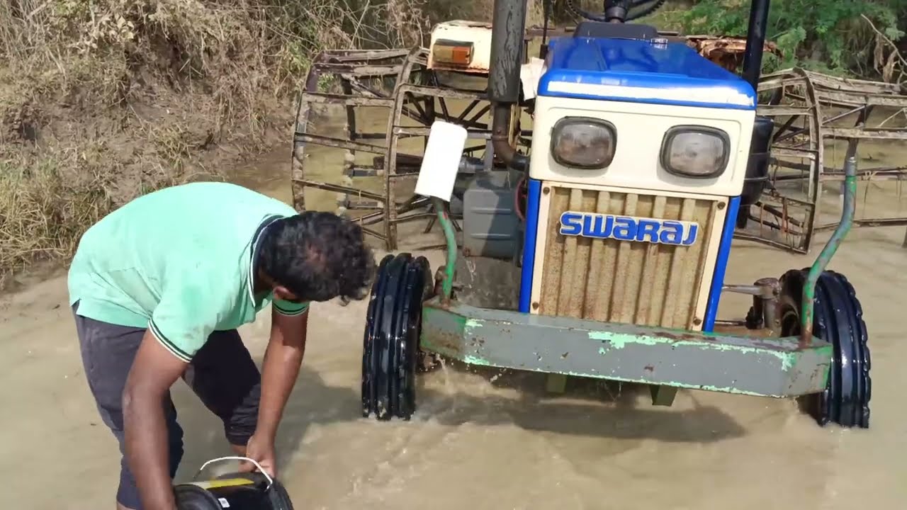 Swaraj 744 tractor going into deep water with Full Iron Cage Puddling ...