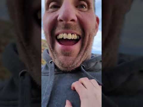 I am tickling my dad in the park! He will be the laughing stock in the whole of West 4th Street!