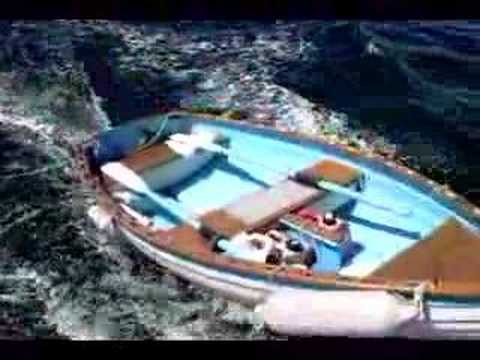 Minto sailing dinghy under tow behind our Cal 29 - YouTube