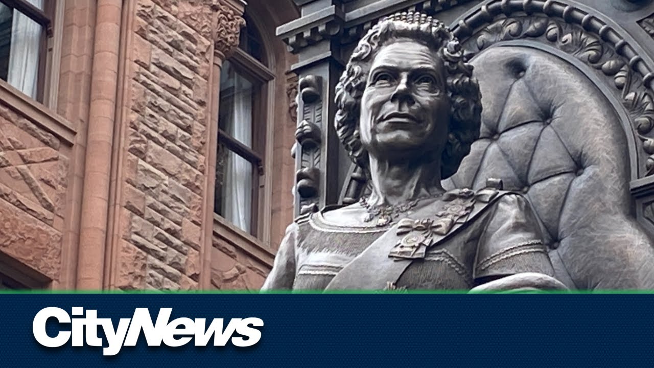 Divisive Queen Elizabeth II statue unveiled outside legislature - YouTube