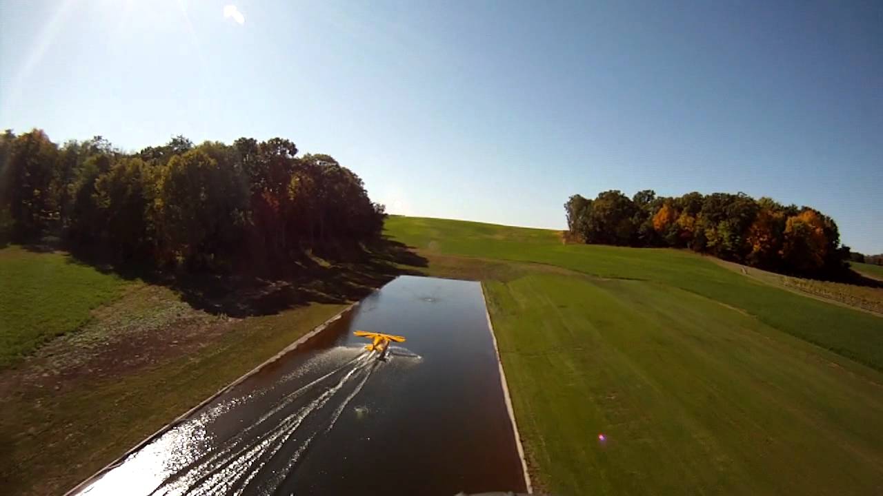 Flying behind 40% RC J3 Cub on Floats - YouTube