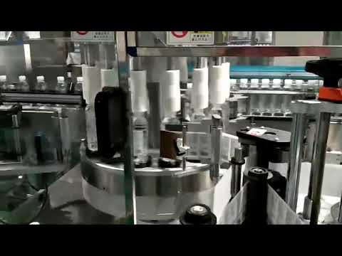 Rotary type self adhesive labeling machine - YouTube
