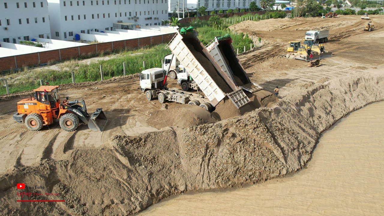Excellence Technique Heavy Equipment Worker Sand In Water With Wheel ...