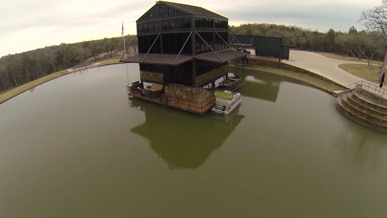 Amazing glass house appears to float on water - YouTube