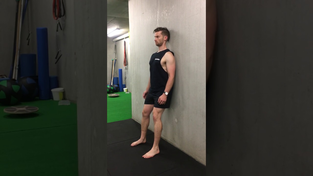 Chin Tuck on Wall - YouTube