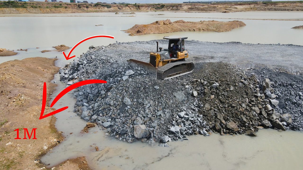 Nice Operator Bulldozer Pushing Rock into Water with Dump Truck ...