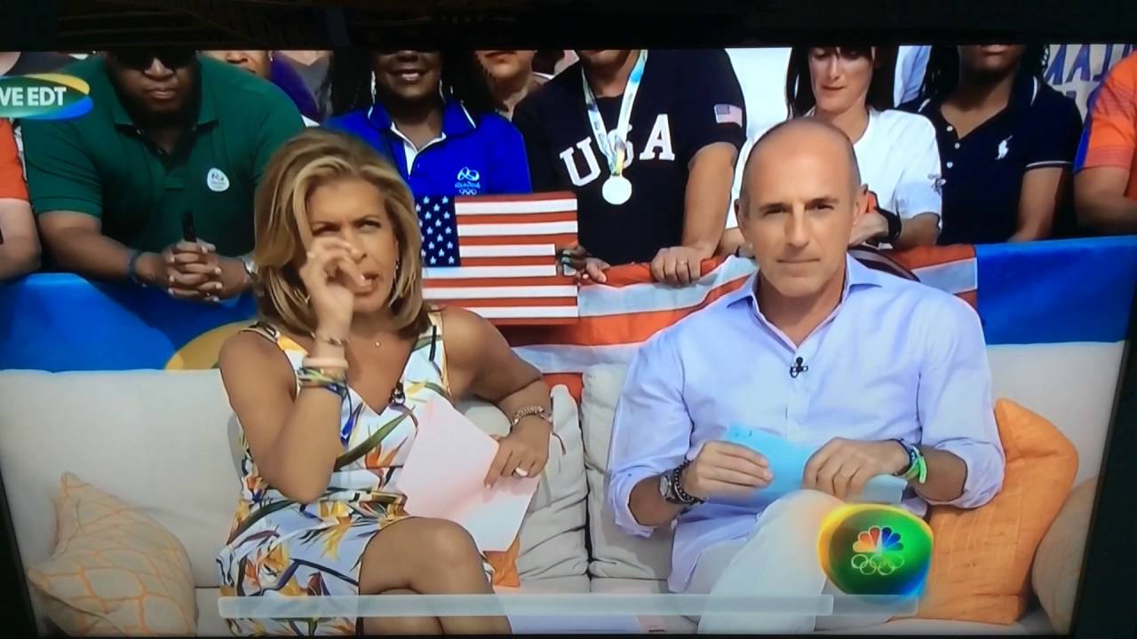Act of kindness - two athletes helping each other on the track. Rio ...