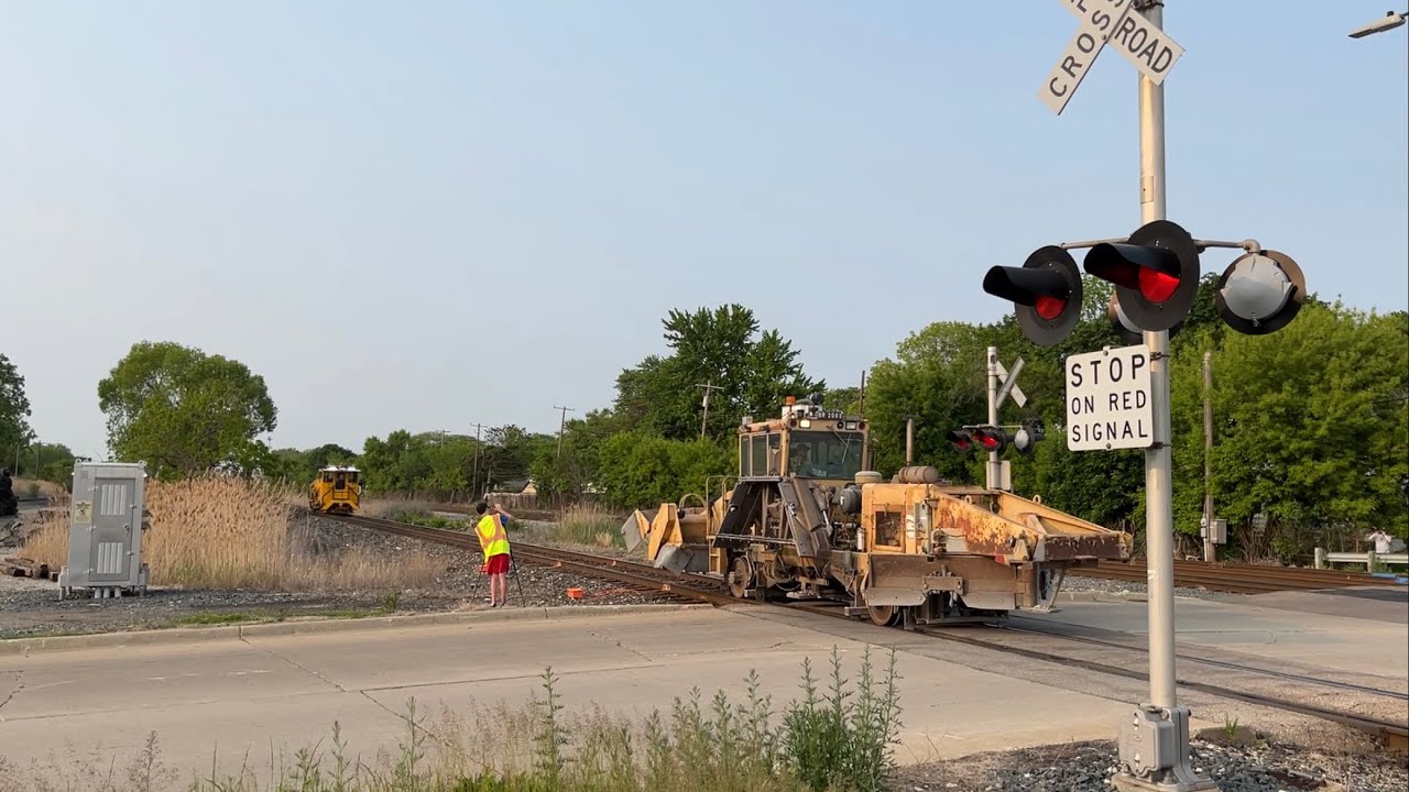 Conrail MOW equipment heads south through Harrison Avenue, Trenton, MI ...