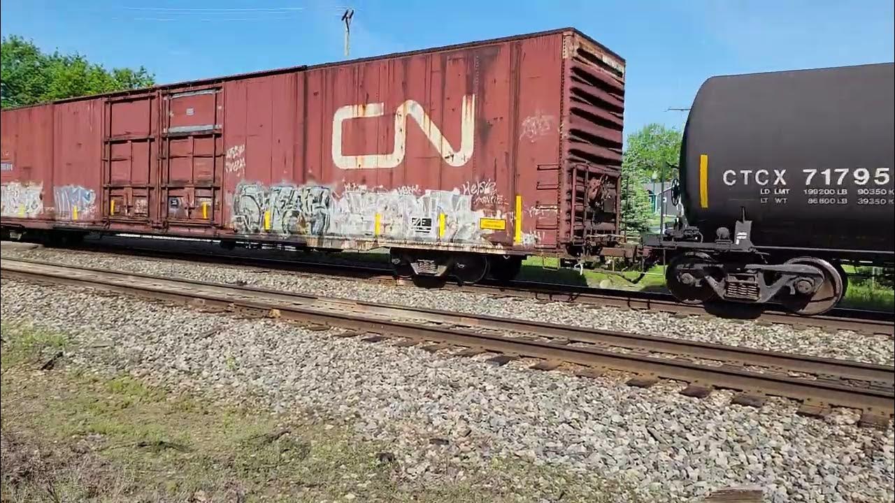 CN 8916, 3919, 2515 rolling Eastbound with CN, ICG 86' box cars, FXE gondola at Vicksburg, MI ...