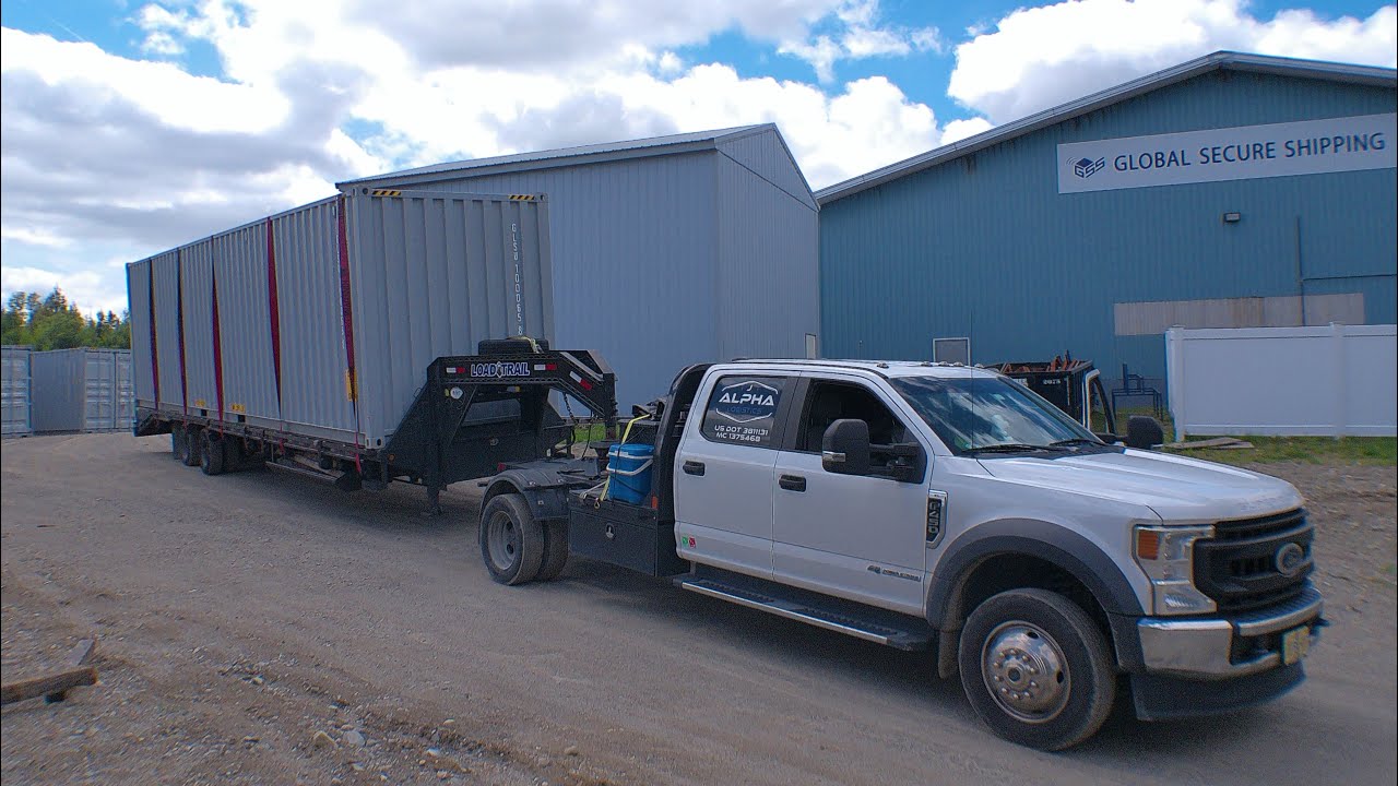 Loading a container with a CombiLift-SC on a 40th load trail trailer ...