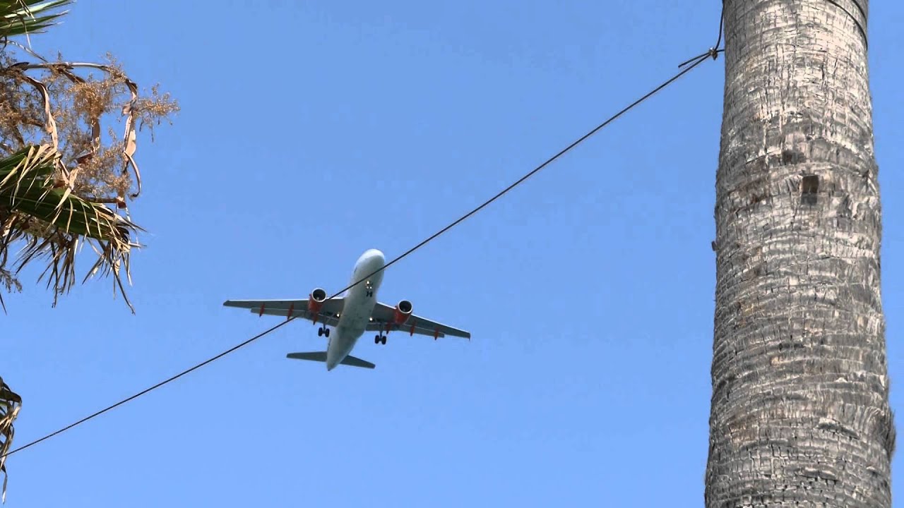Plane landing over playa d'en bossa beach - bora bora ibiza - YouTube