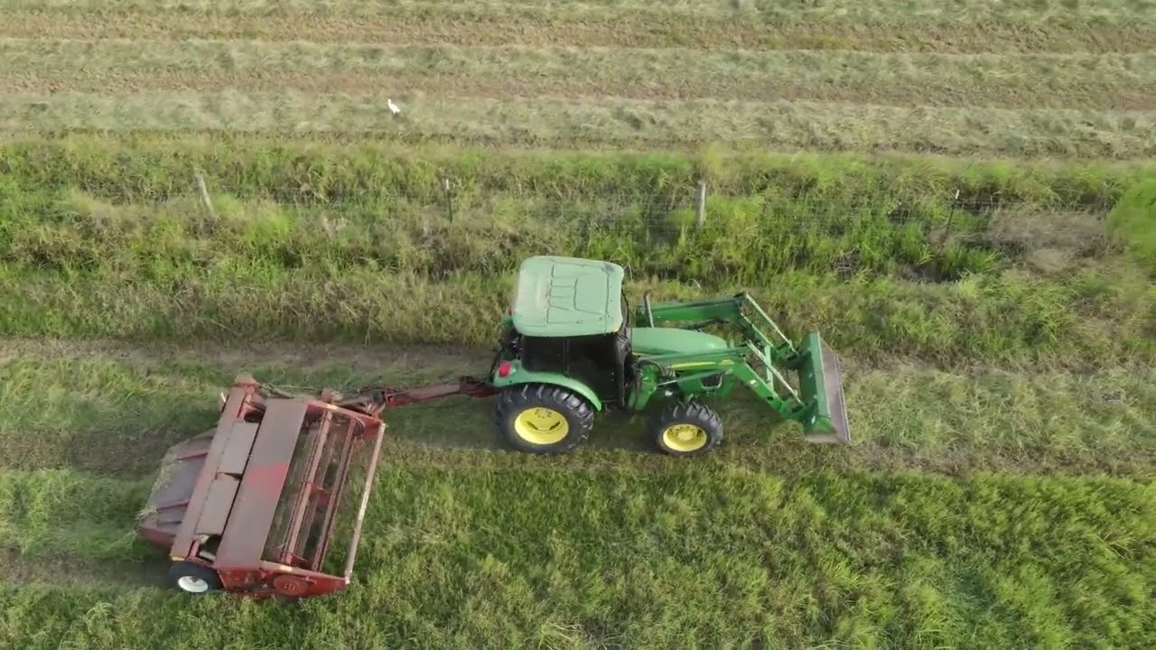 Cutting Hay and Loading a Client's Large Trailer with Round Bales - YouTube