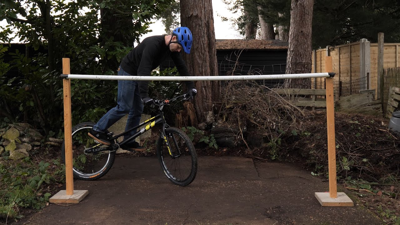 Bike Trials - Side hops over the bar - jumping from the back wheel ...