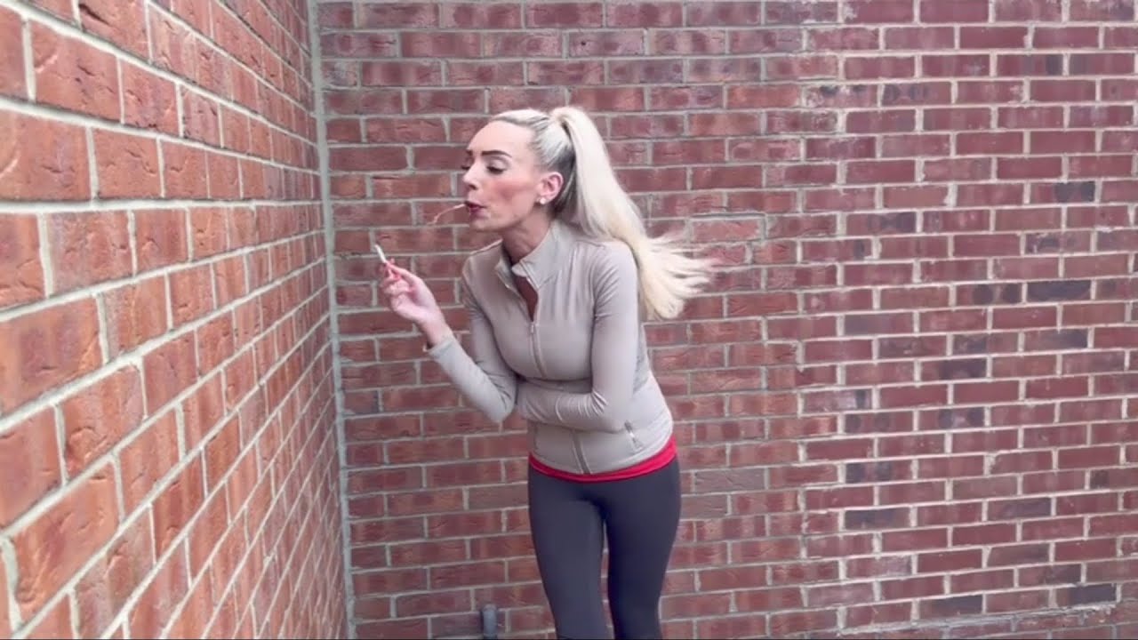 BLONDE GIRL SPITTING ON WALL AND SMOKING - YouTube