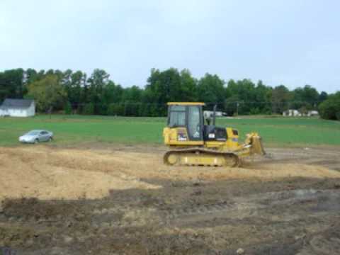 Bulldozer Spreading Dirt out - YouTube