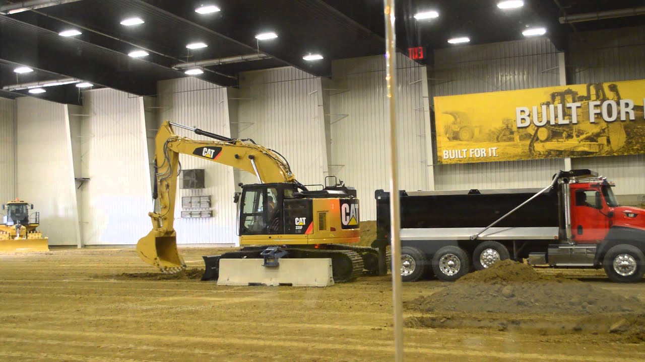 Caterpillar's 335F hydraulic excavator in action - YouTube