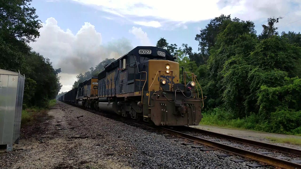 CSX SD40-2 # 8027 Leads A Wet Rock Train As It Climbs The Hill At CR39 ...