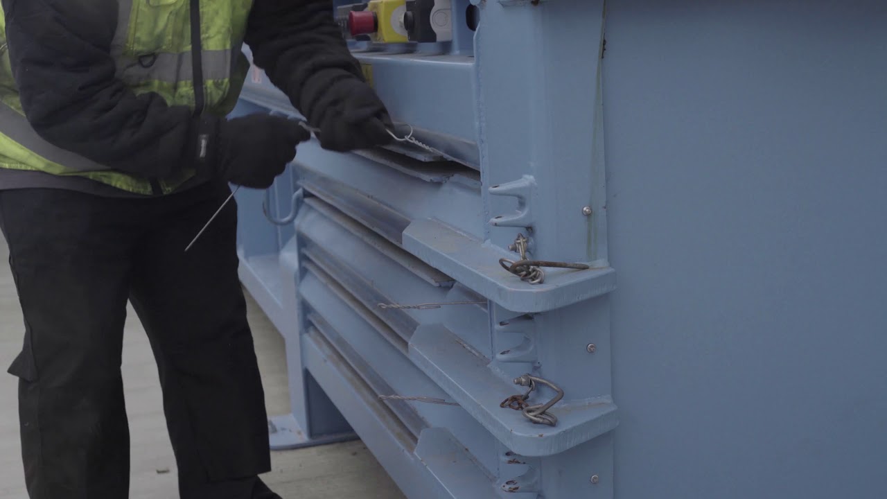 How to tie off a bale - Greenbank Semi Automatic Baler - YouTube