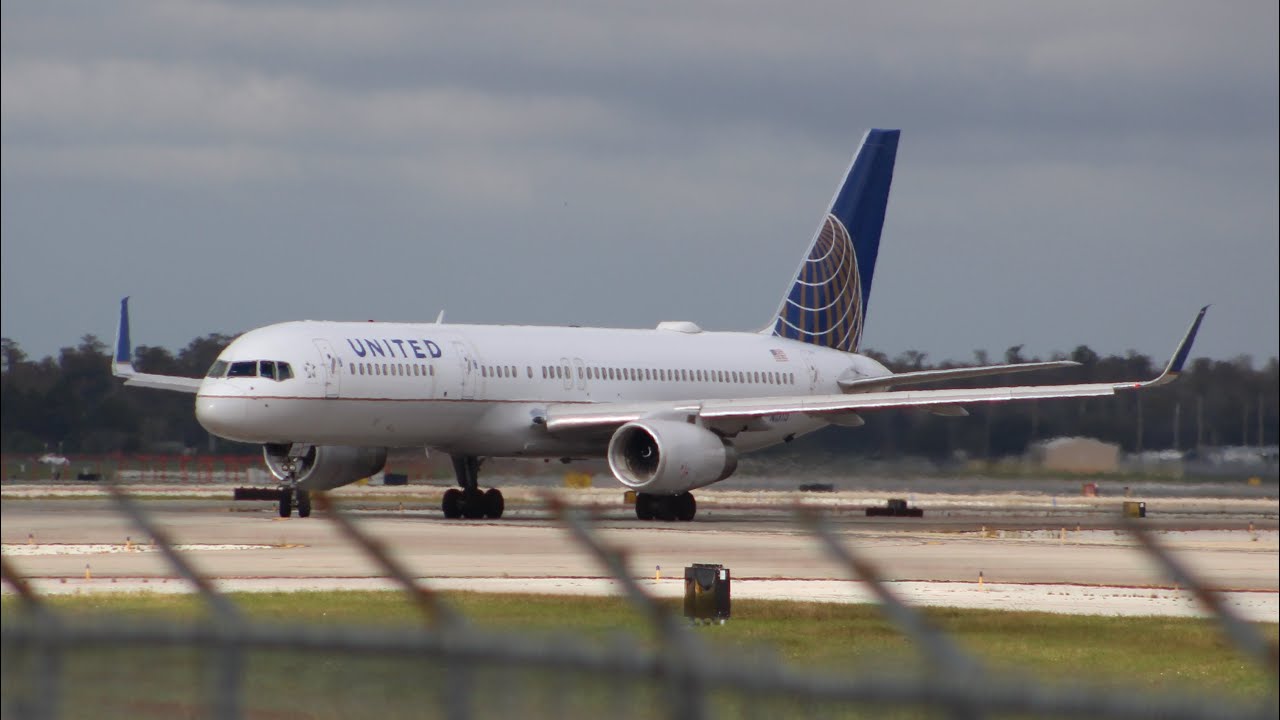 United B757-224 touching down at MCO’s runway 35L after a flight from ...