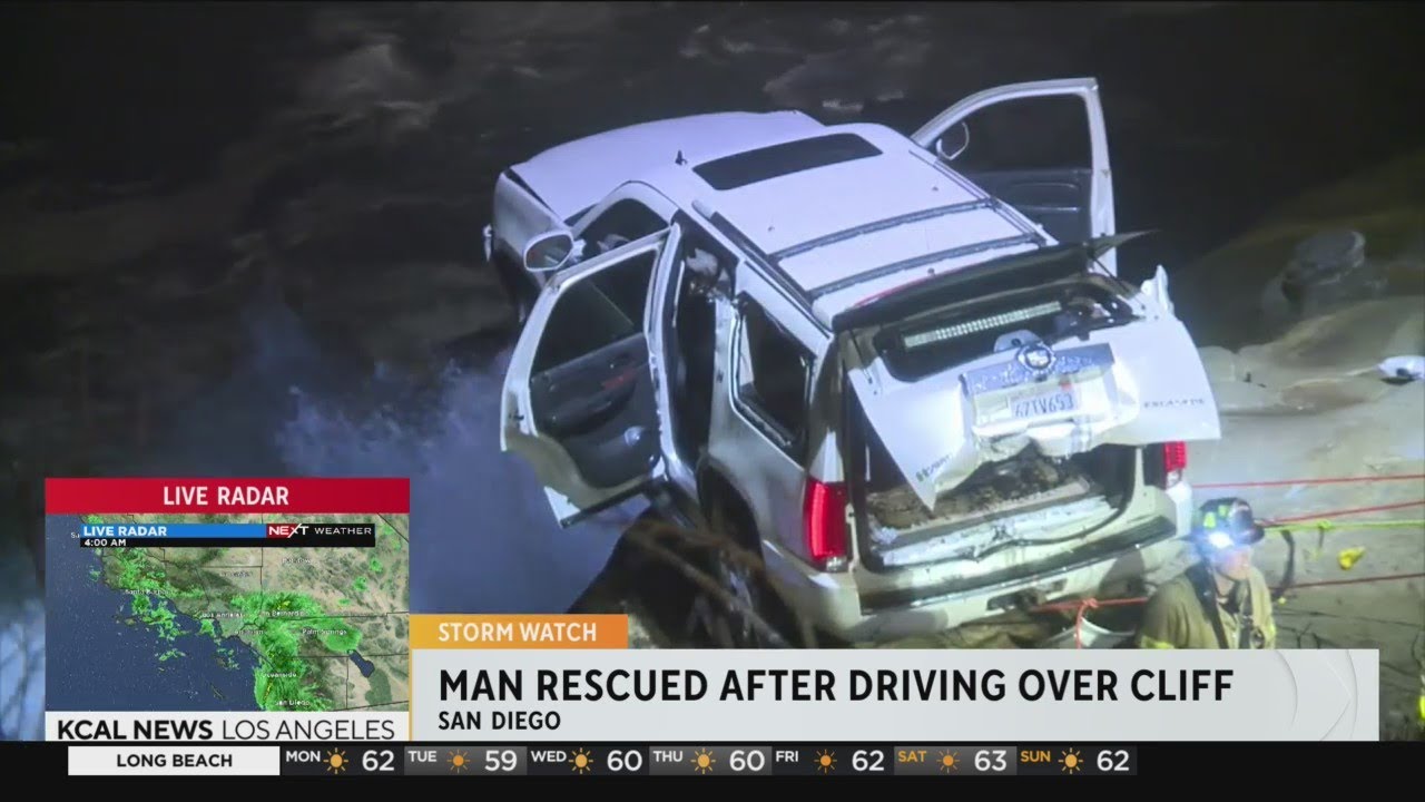 Driver rescued from SUV dangling over San Diego cliff - YouTube