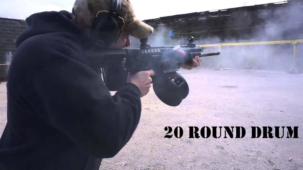 Suppressed 12 Gauge with 30rd drum mag - YouTube