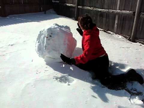 pushing giant snowball - YouTube