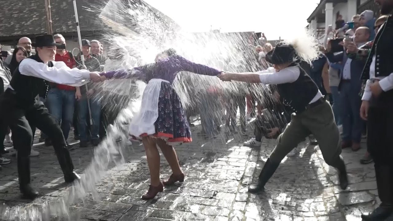 Men throw buckets of water on women during unique Easter Monday ...