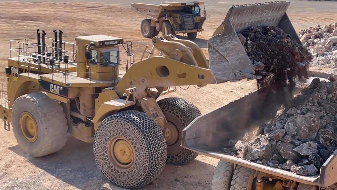 Huge Caterpillar 994 Wheel Loader Loading Caterpillar 777F Dumpers ...