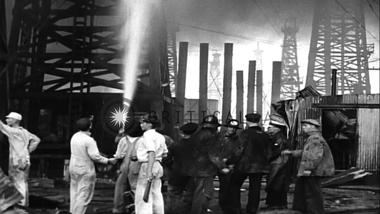 Fire fighters try to extinguish fire at an oil refinery in Long Beach ...