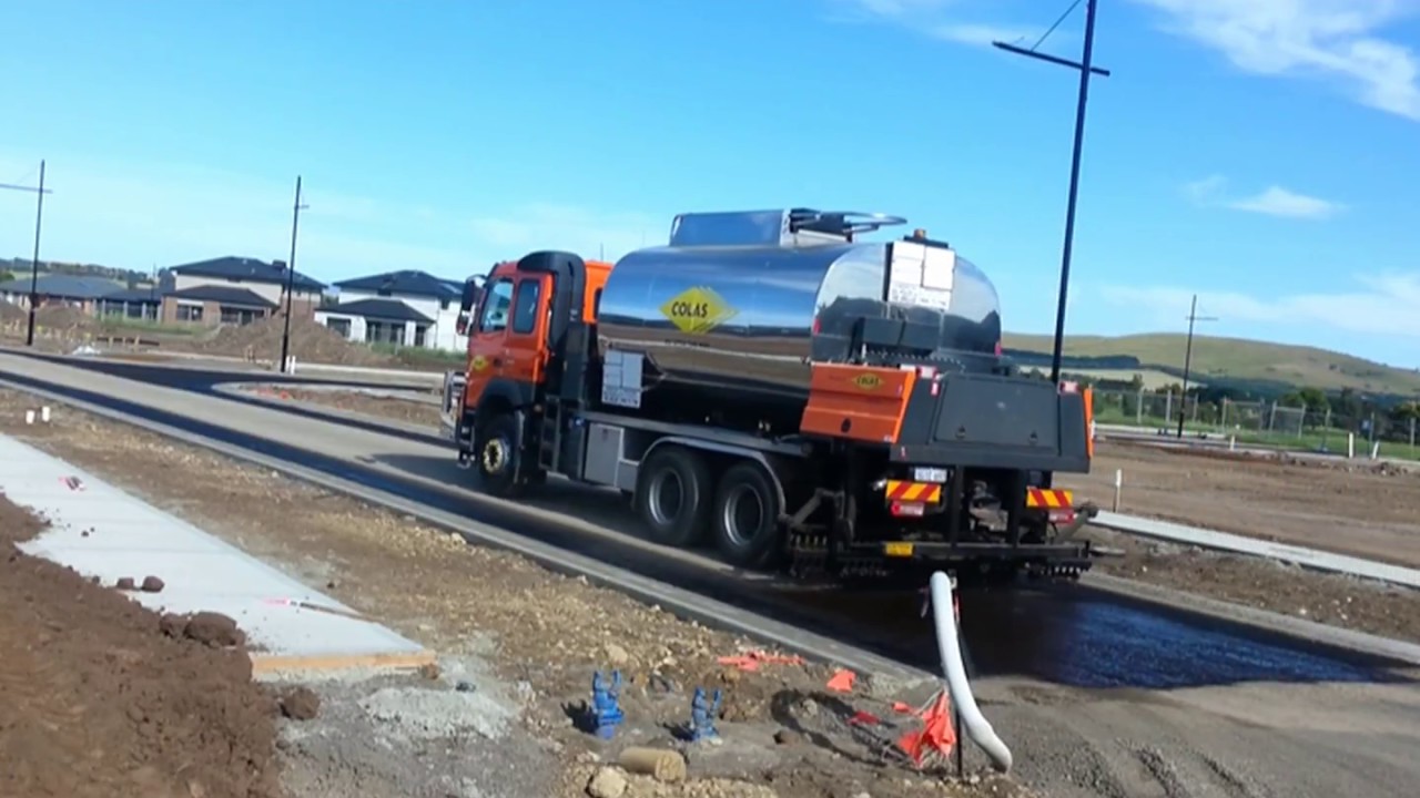 Asphalt sprayer in action. - YouTube