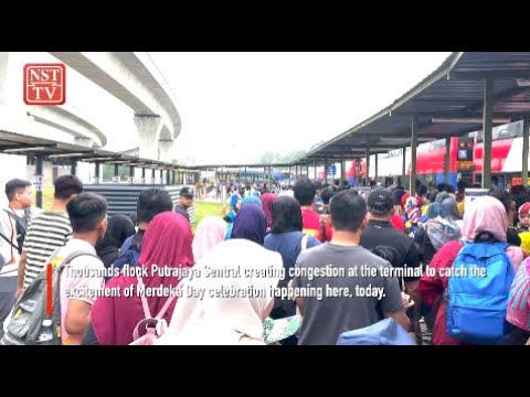 Thousands crowd Putrajaya Sentral in a rush to catch the Merdeka parade ...