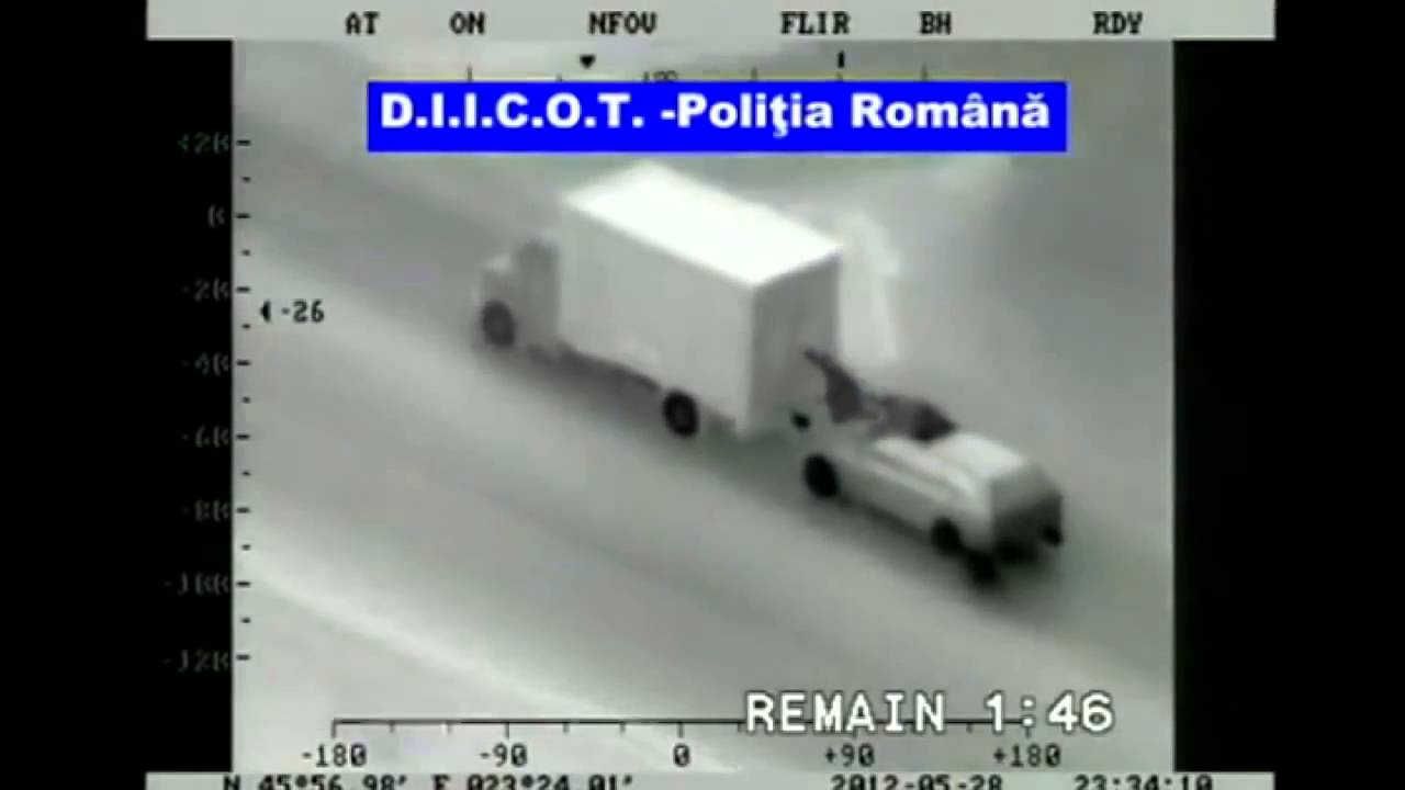 Romanian gang attempt truck robbery from bonnet of moving car - YouTube