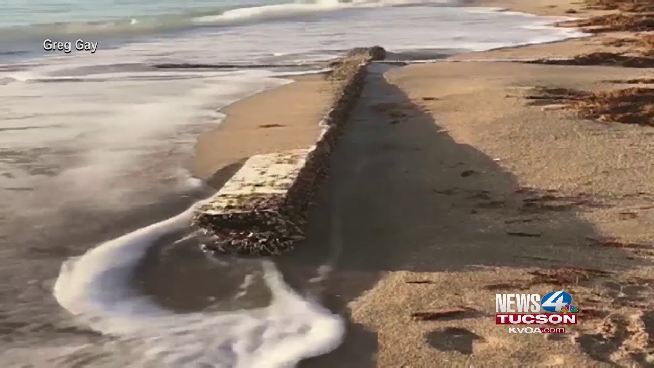 Tourists mystified after giant cross washes up on Florida beach - YouTube