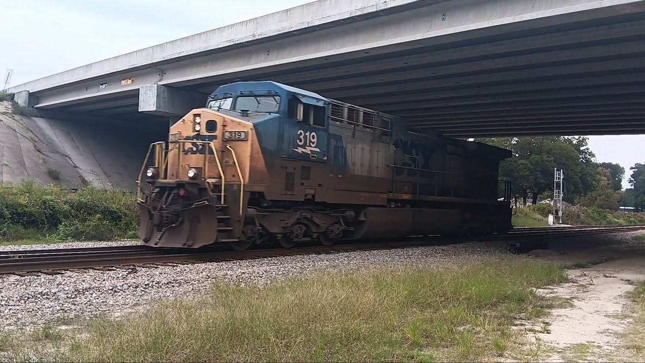 CSXT 319 AC44CW in YN2 paint heads down to the Auto ramp in Dixiana SC ...