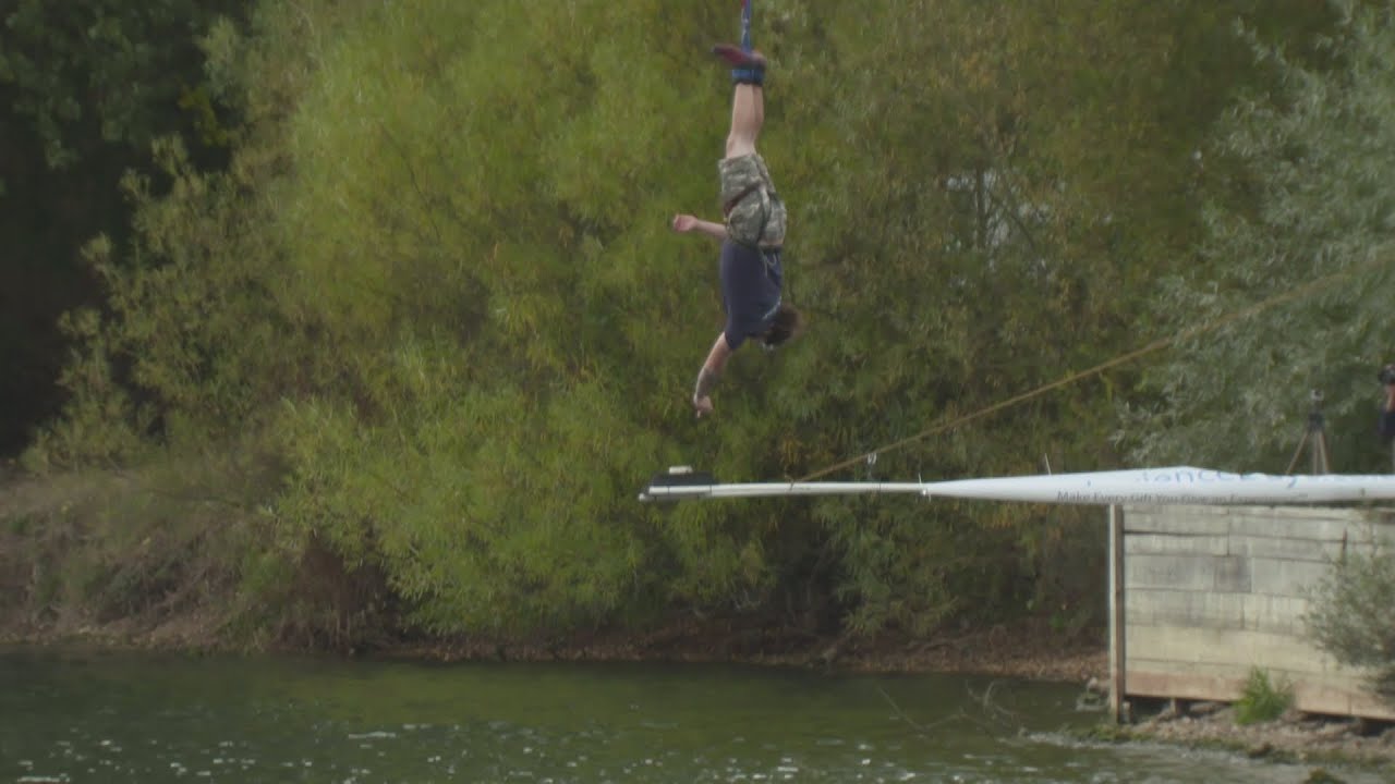 Guinness World Record won for bungee 'dunk' into cup of tea - YouTube