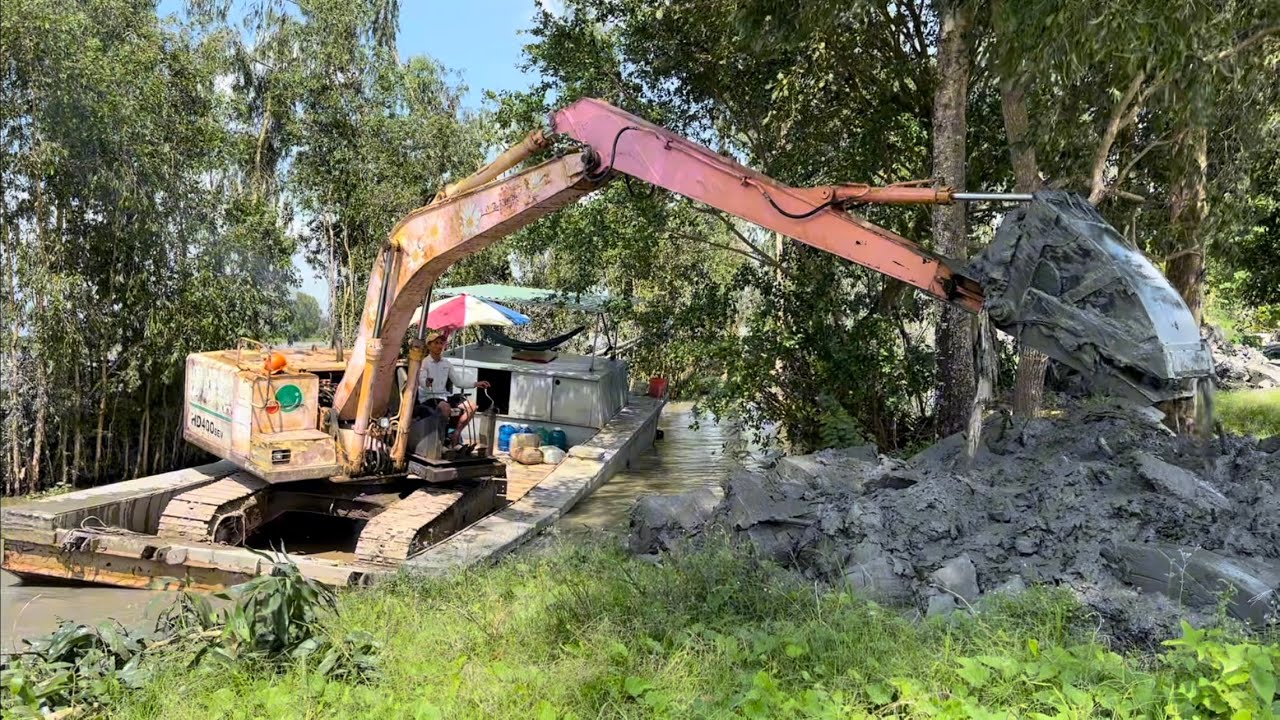 Pink folding 03 excavator dredging river - YouTube