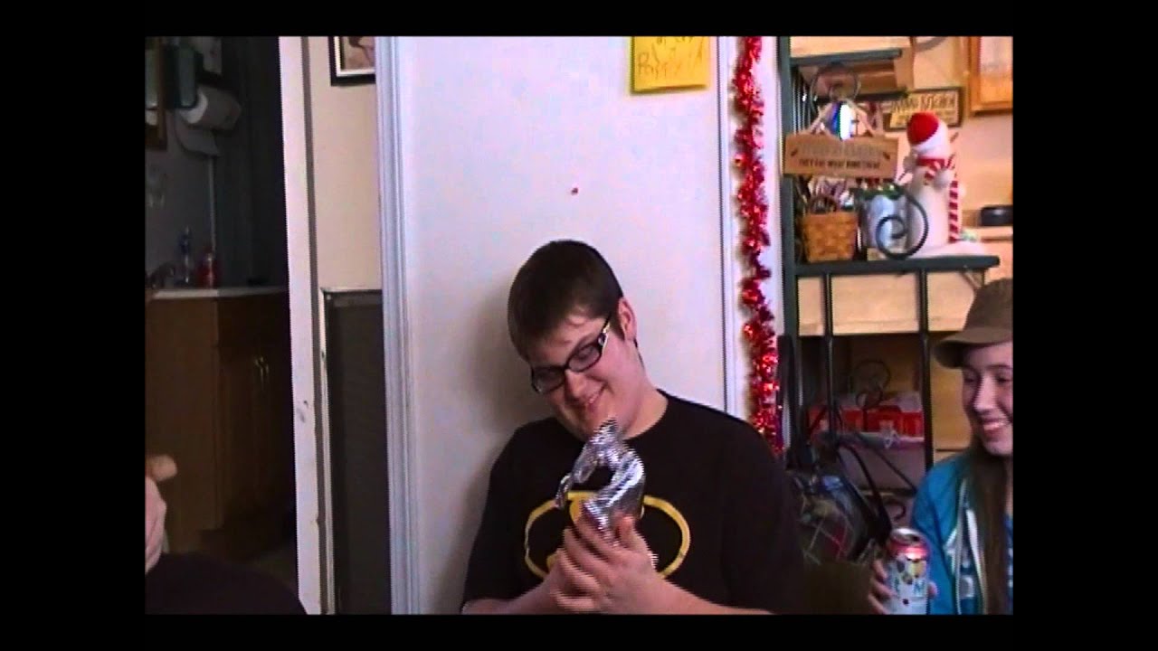Andrew opening his "burrito" on Christmas morning! - YouTube