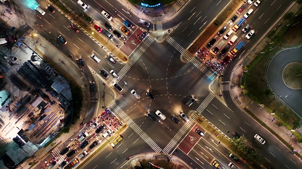 From Above Footage Of Vehicular Traffic On A Busy Street Intersection ...