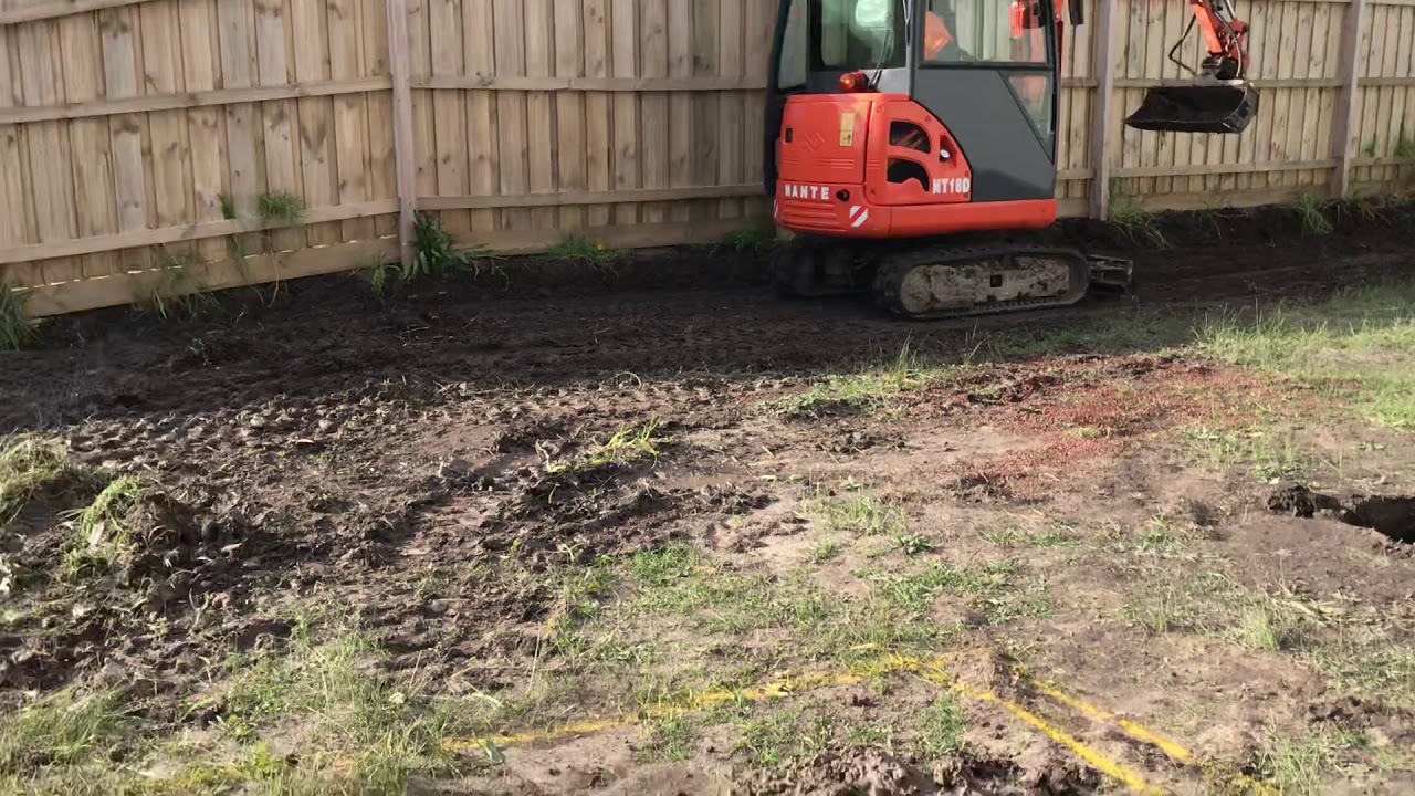 Digging out the driveway and carport for the new house. - YouTube