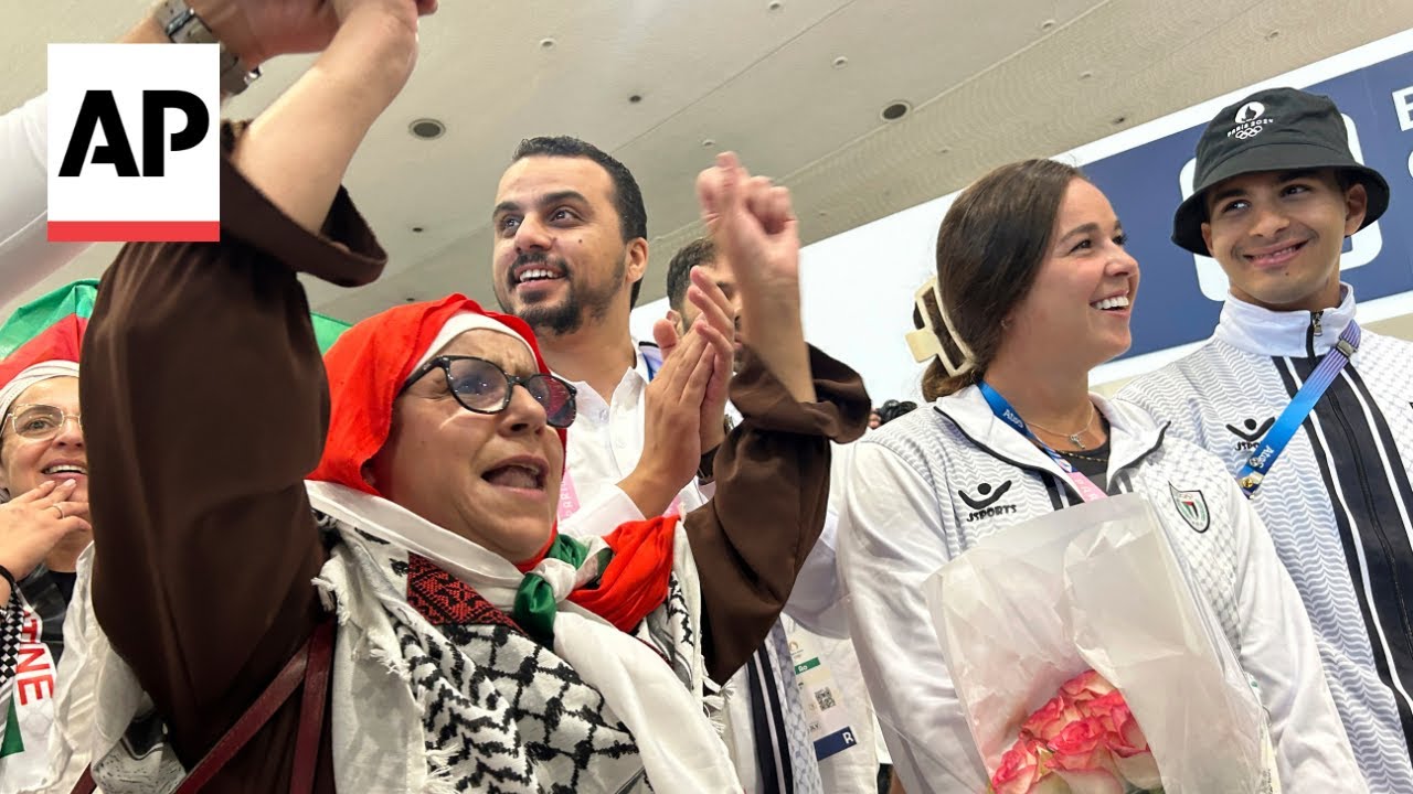WATCH: Palestinian Olympics team met with cheers in Paris - YouTube